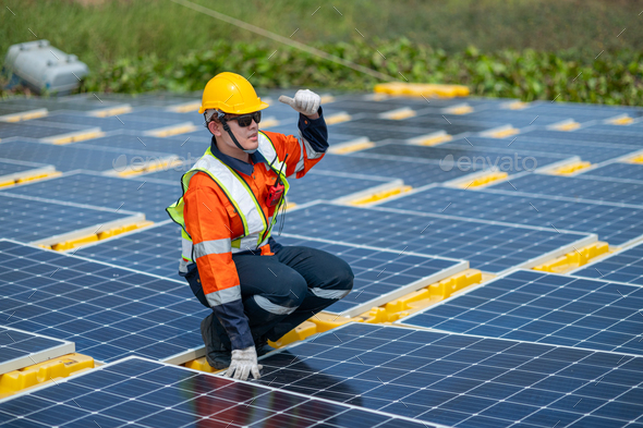 Solar Field Technician Examining Panel Efficiency Stock Photo by ...