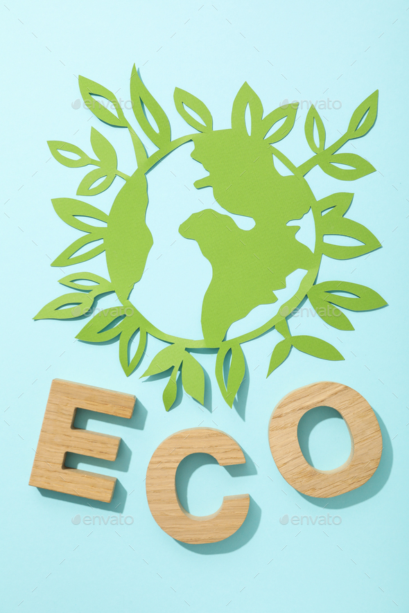 The word eco with a paper model of the Earth Stock Photo by AtlasComposer