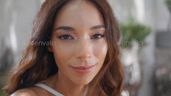 Gorgeous woman face looking camera with gentle smile at sunlight ...