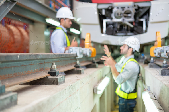 Engineers check the readiness of electric train tracks at the ...