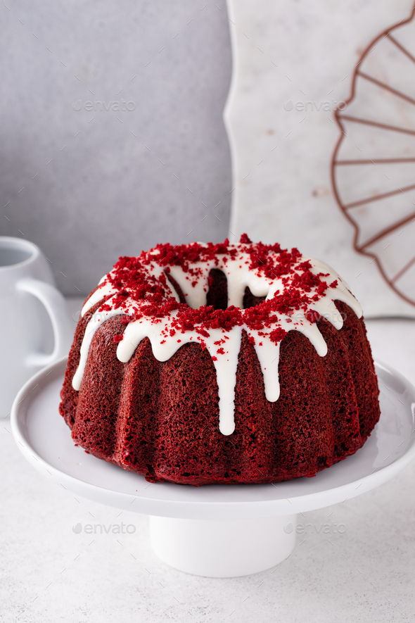 Red velvet cake with cream cheese glaze and red velvet crumbs on top ...