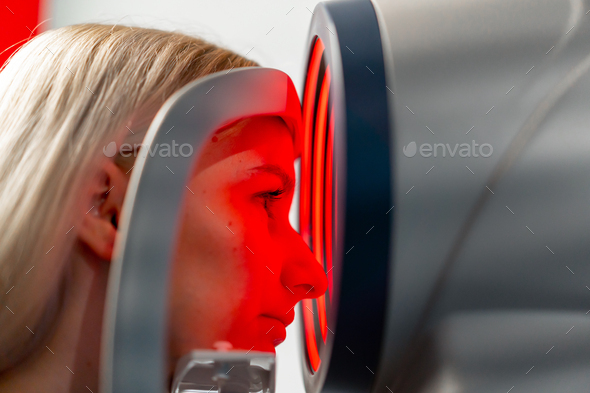 close-up in an ophthalmology clinic a young girl diagnoses vision using ...