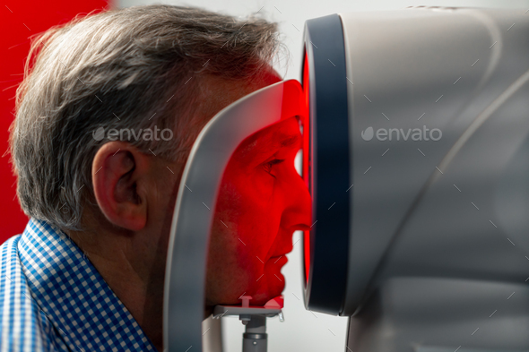 in ophthalmology clinic elderly patient is diagnosed with a vision test ...