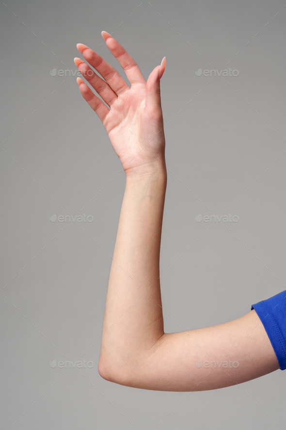 Female hand sign against gray background in studio Stock Photo by ...
