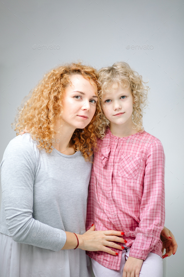 little girl looks like her mother Stock Photo by Albertshakirov | PhotoDune