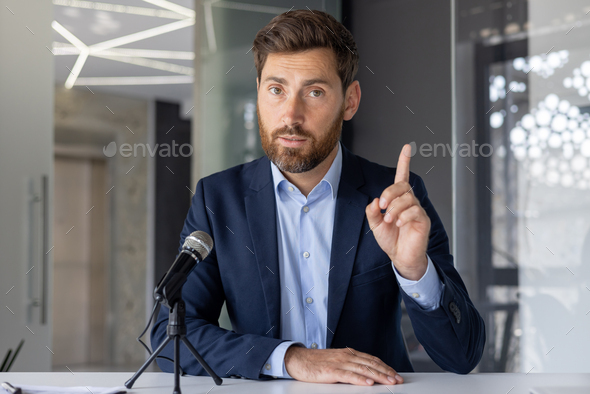Professional man making a point during an online speech Stock Photo by ...