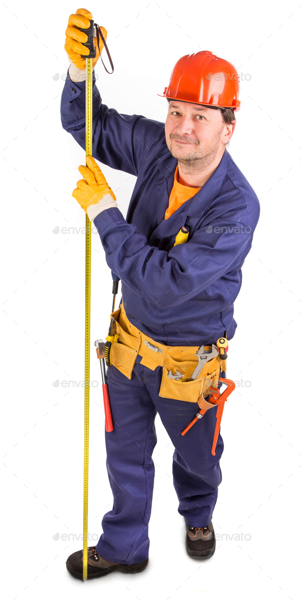 Worker in hard hat measure with ruler. Stock Photo by indigolotos ...
