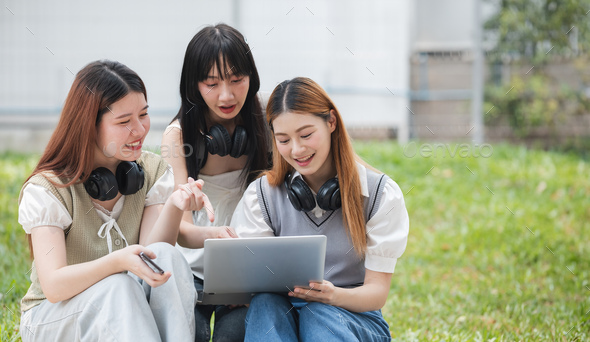 Group Of Young Asian Students Collaborating Outdoors at University ...