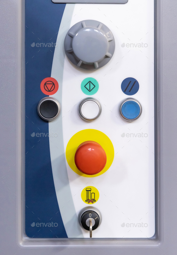 Grey control panel with buttons and switches for machinery operation in ...