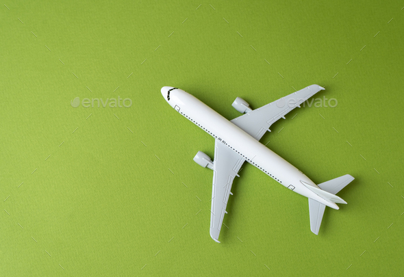 Airline plane on green background. Airline. Stock Photo by iLixe48