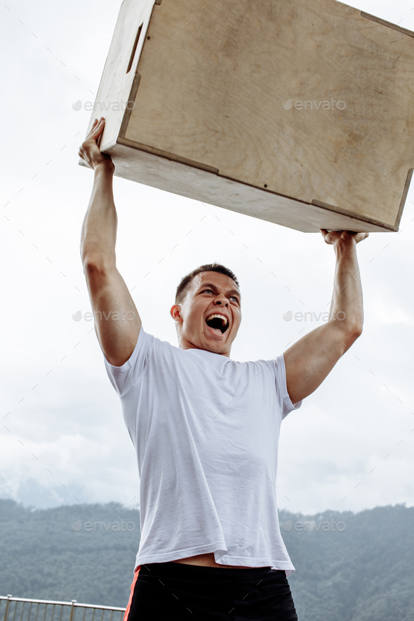 Cross Fit Weight Lifting exercise man workout outdoor, lifting heavy ...