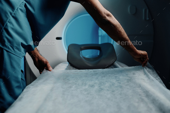 Radiographer Preparing CT Scanner Bed Stock Photo by AnnaStills | PhotoDune
