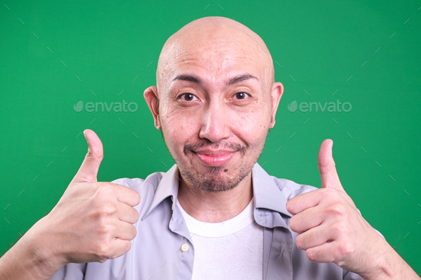 Bald Man Showing Thumbs Up Stock Photo by Garakta-Studio | PhotoDune