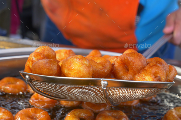 Traditional fried sweets lokma in sugar syrup Stock Photo by towfiqu98