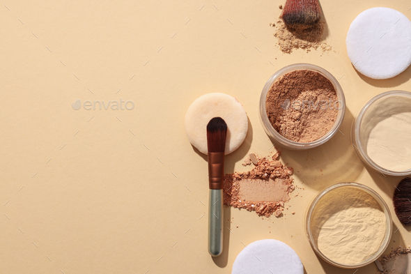 Bottles of face powder, different shades, on a pastel background. Stock ...