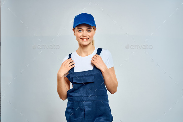 woman in work uniform blue cap service delivery service light ...