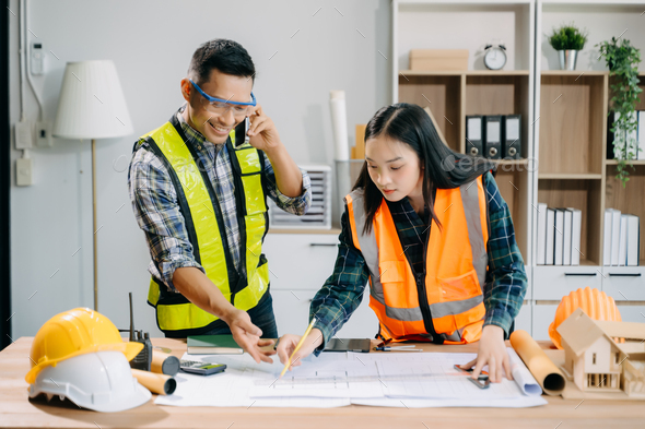Engineer desk with object paper and tablet with blurry engineer ...