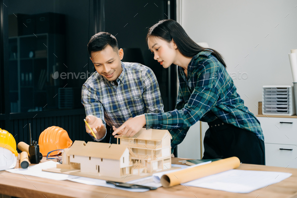 Engineer desk with object paper and tablet with blurry engineer ...