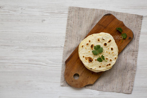 Homemade Roti Chapati Flatbread on a rustic wooden board, top view ...