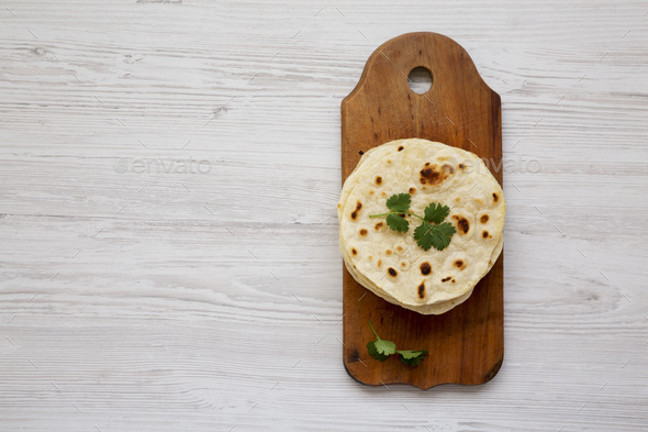 Homemade Roti Chapati Flatbread on a rustic wooden board, top view ...