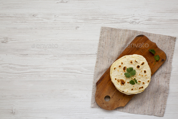 Homemade Roti Chapati Flatbread on a rustic wooden board, top view ...