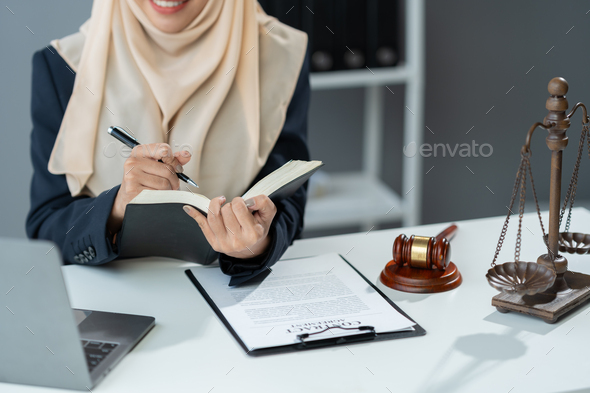Muslim woman lawyer wearing hijab asian, legal advisor, taking note and ...