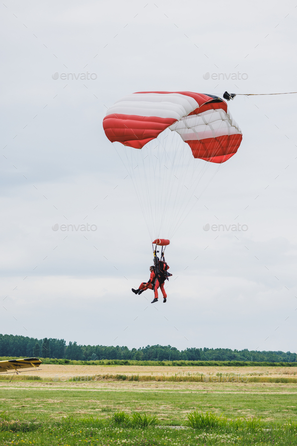 Tandem Paraglider Landing Stock Photo by micens | PhotoDune
