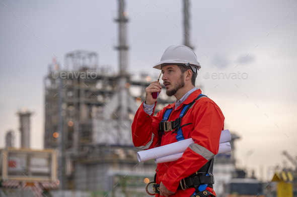 Engineer survey team wear uniform and helmet stand workplace checking ...