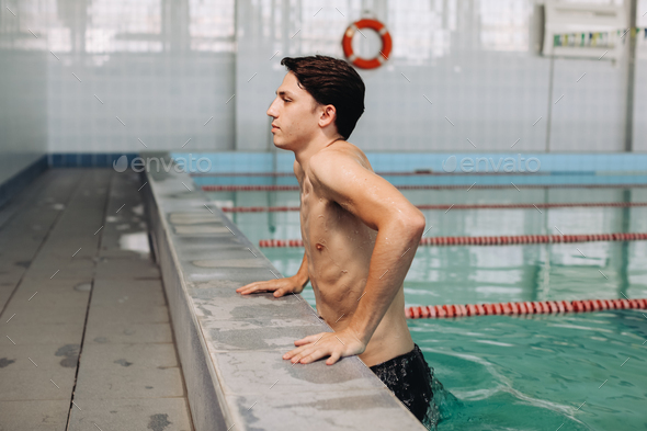 Male swimming instructor posing in the swimming pool Stock Photo by ...
