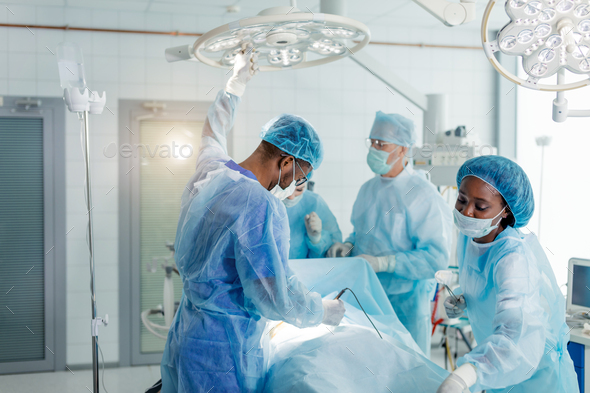 modern surgical practice. team members taking part in difficult ...