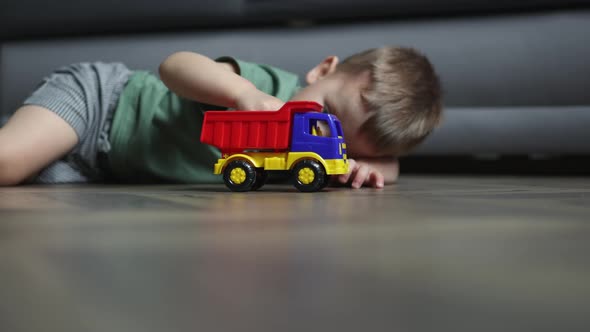 Caucasian Preschooler Boy Kid Child Playing Toy Car Truck on Floor ...