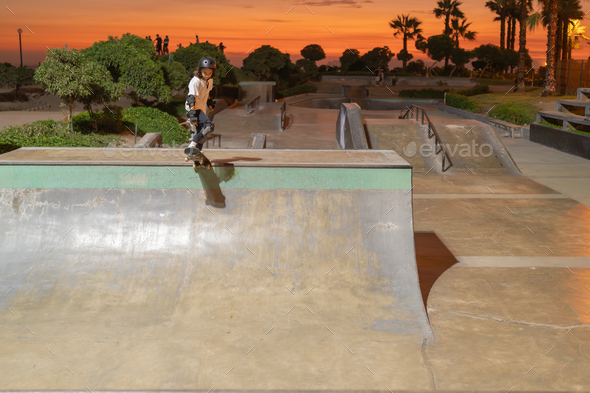 Boy skateboarding down a big ramp wearing protection Stock Photo by GSR ...