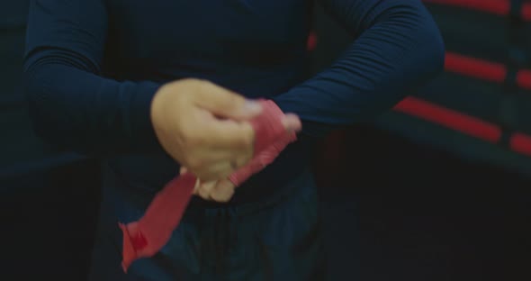 Kickboxer is Wrapping Hand Before Fight or Training Closeup View in Gym ...