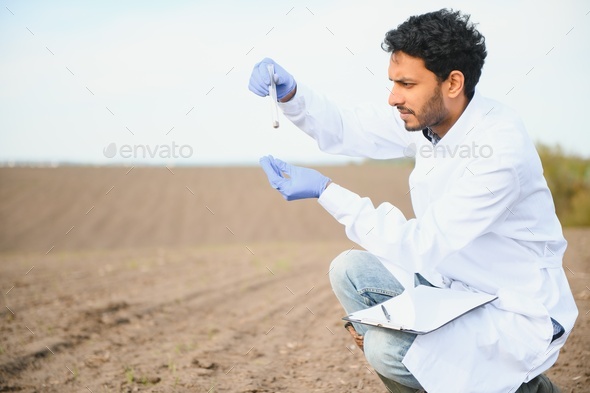 Soil Testing. Indian Agronomy Specialist taking soil sample for ...
