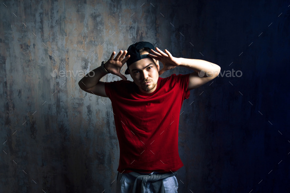 crazy rapper showing coool hand gesture Stock Photo by Albertshakirov