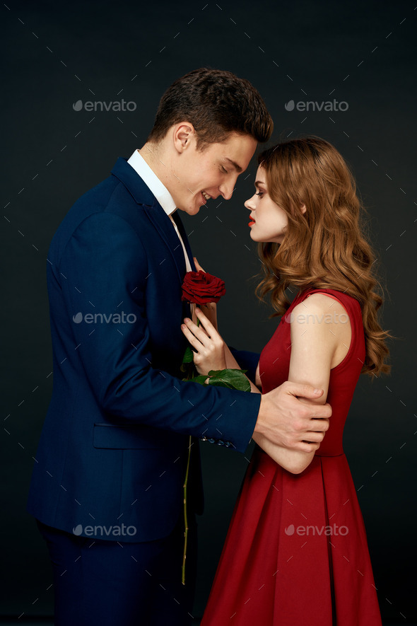 luxury couple hug romance relationship rose over dark isolated ...
