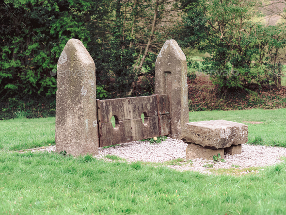 Public stocks in the middle of the village green medieval crime ...