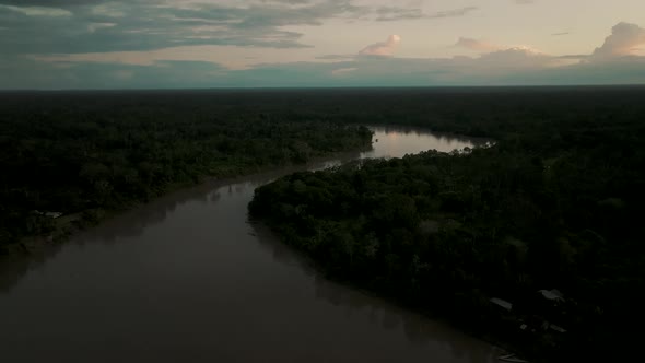 Aerial View Of Amazon River Surrounded With Lush Rainforests At Sunset ...