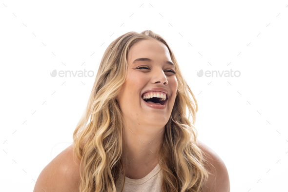 Young Caucasian female plus size model laughing, showing joy on white ...