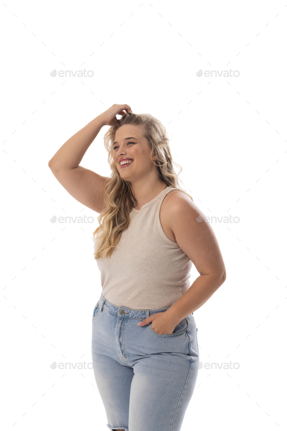 Plus size model with blonde hair poses on white background, copy space ...