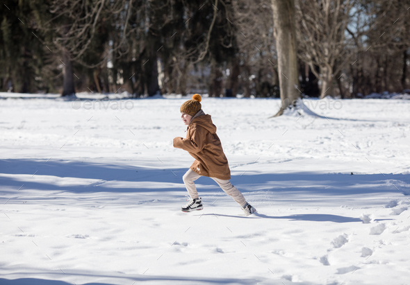 outdoor winter portrait of boy face in the snow. Authentic, real ...