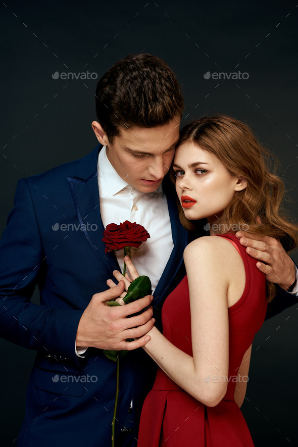 luxury couple hug romance relationship rose over dark isolated ...