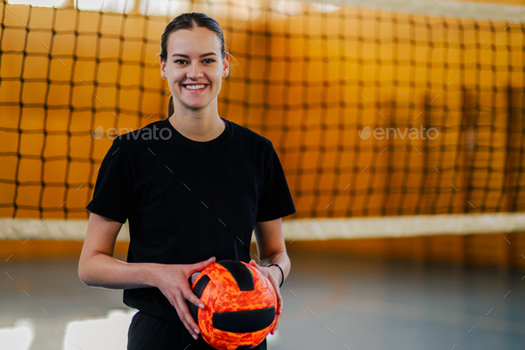 Portrait of a smiling female professional volleyball player Stock Photo ...