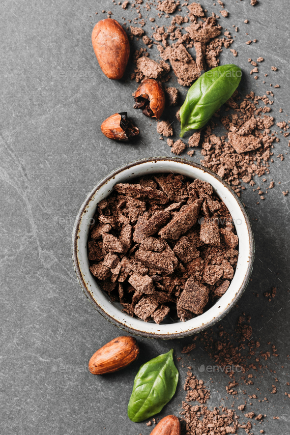 cocoa butter and cocoa crumbs on a grey stone Stock Photo by ninelutsk