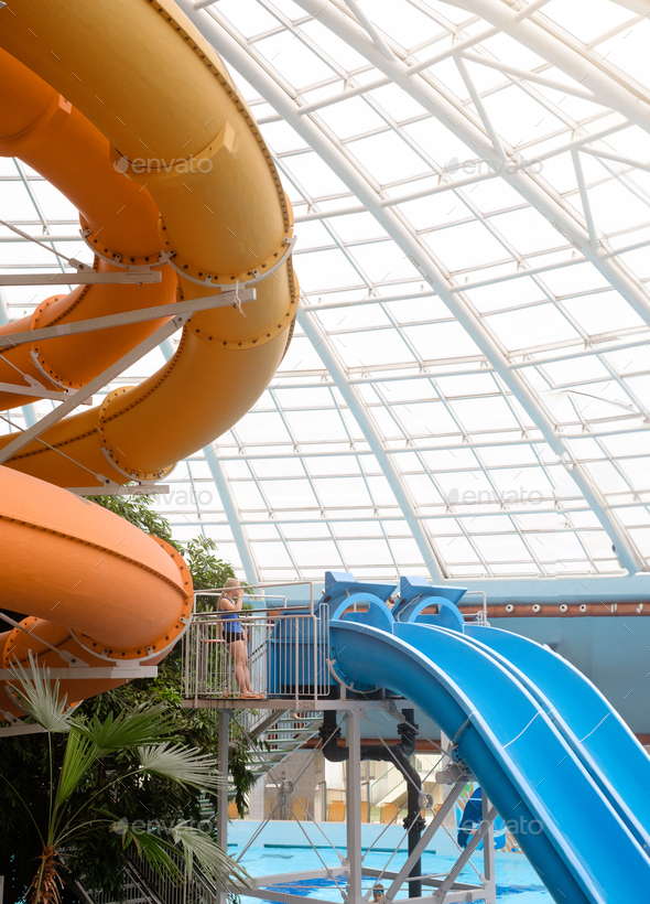 Indoor aqua park with water slides Stock Photo by ninelutsk | PhotoDune