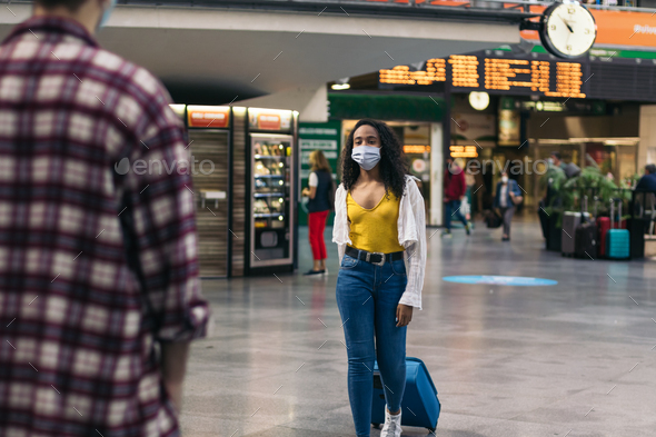 Reunited at last!: Young couple meeting at the station after a trip ...