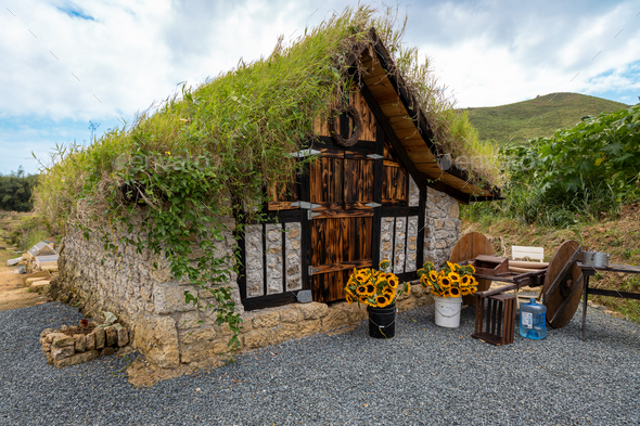 Farm shack in the countryside on a cloudy day Stock Photo by wirestock