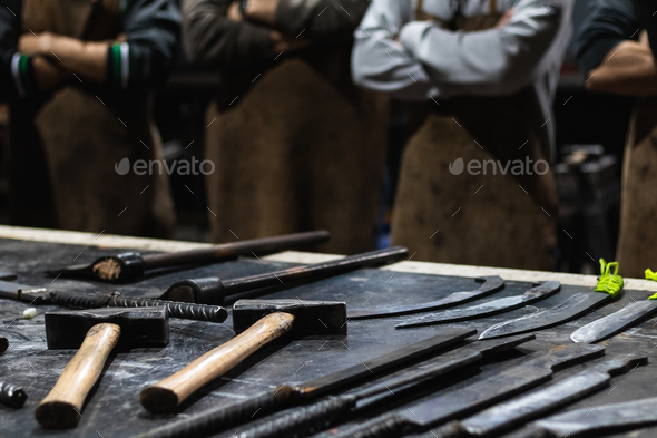 Different metal sharp tools at workbench Stock Photo by ADDICTIVE_STOCK