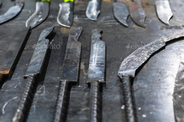 Different metal sharp tools at workbench Stock Photo by ADDICTIVE_STOCK