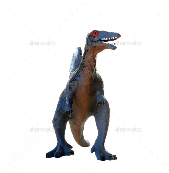 Detailed plastic toy model of a blue spinosaurus dinosaur against a ...